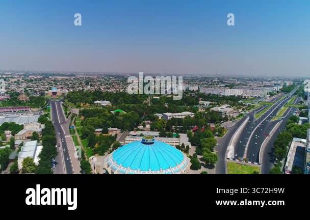 The drone flies over the roads and highways of the city with moving ...