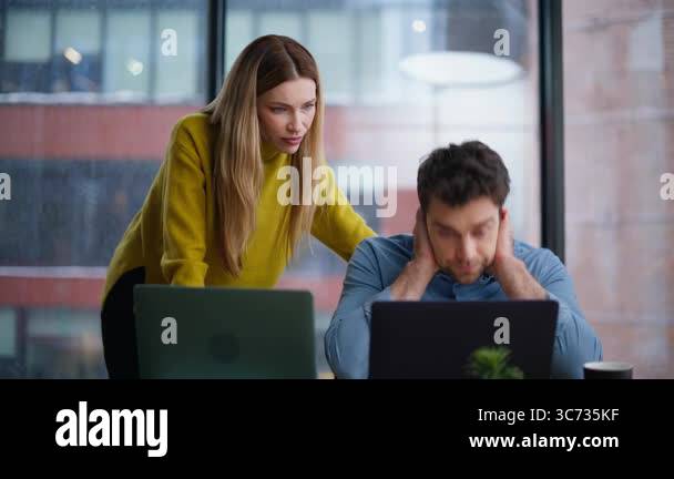 Professional trainer teaching intern dissatisfied work at laptop in ...