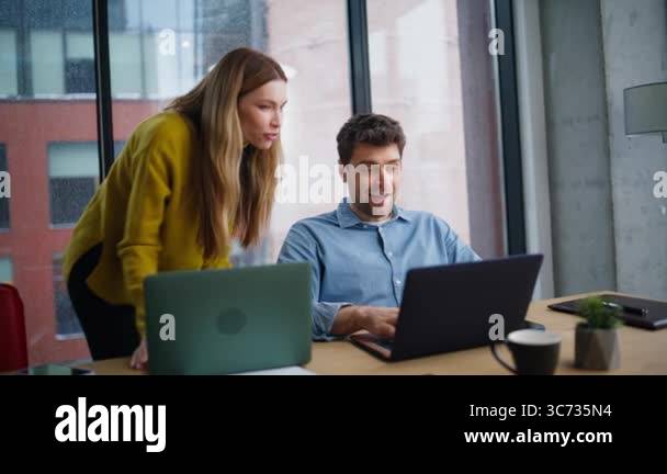 Woman supervisor mentoring employee checking work at laptop closeup ...