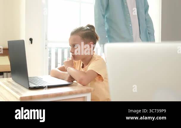Caucasian teacher helping asian student coding engineering prompt while ...