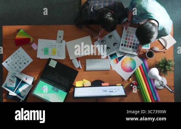 Top down view of smart designer helping manager choosing color from ...