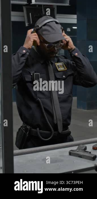 Medium vertical of confident African American security officer or ...