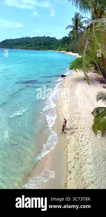 Walk along the pristine sandy shores of Koh Kood Island, where azure ...