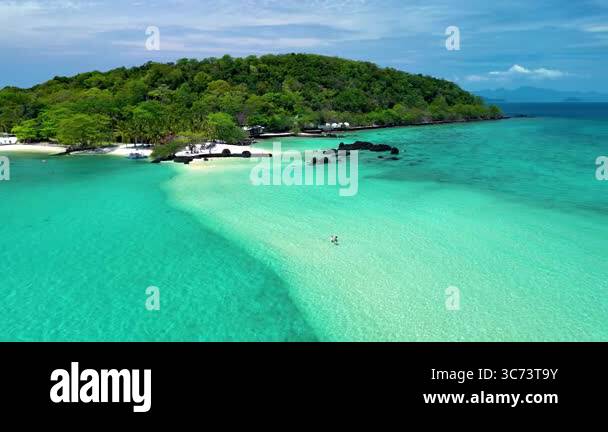 Discover the stunning shores and clear turquoise waters of Koh Kham ...