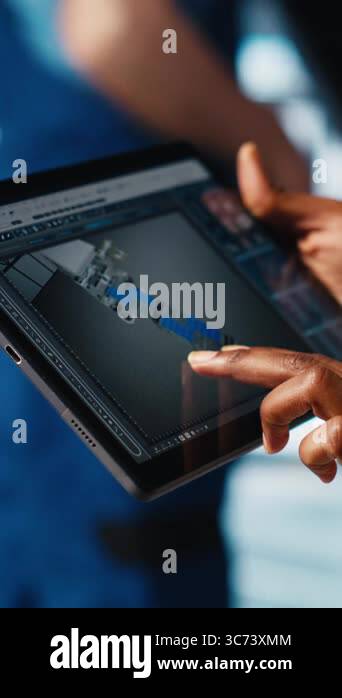 Vertical video Industry 4.0 industrial plant engineer designs new robotic machines using CAD ...