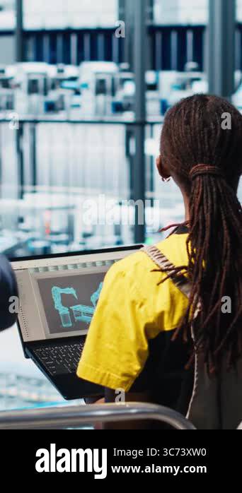 Vertical video Manager overseeing industry 4.0 industrial plant gives ...