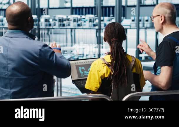Manager overseeing industry 4.0 industrial plant gives instructions to ...
