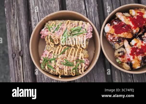 Overhead perspective showing two different types of sushi takeaway in ...
