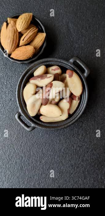Brazil nut in a bowl, a food with selenium content. Useful vegan food ...