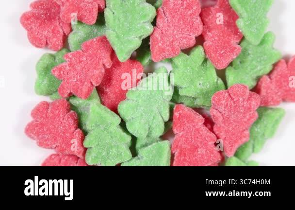 Red and green soft chewy candy trees spinning clockwise - shallow depth ...