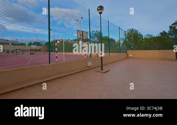 A vibrant sports area that features a basketball court beautifully ...