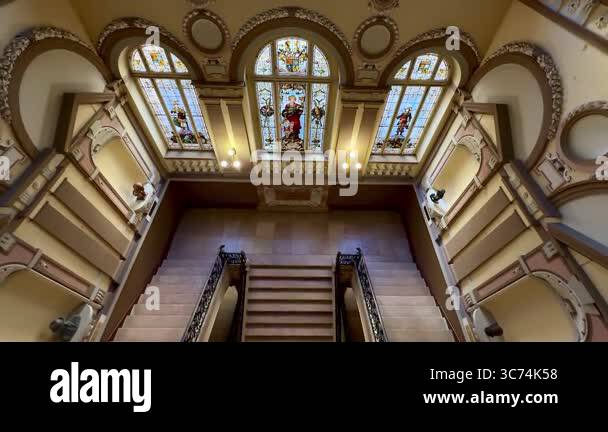 There is a stunningly beautiful view of an ornate staircase showcasing ...