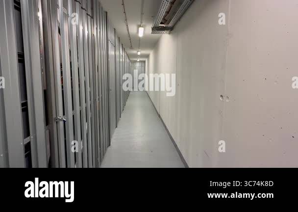 A sleek and minimalistic corridor that is lined with streamlined metal ...