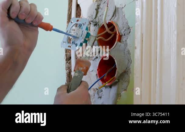 Electrician is installing new electric sockets Stock Video Footage - Alamy