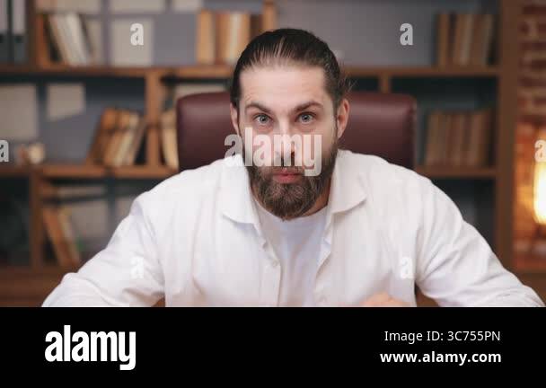 Middle-aged handsome business man surprised and shocked in office ...