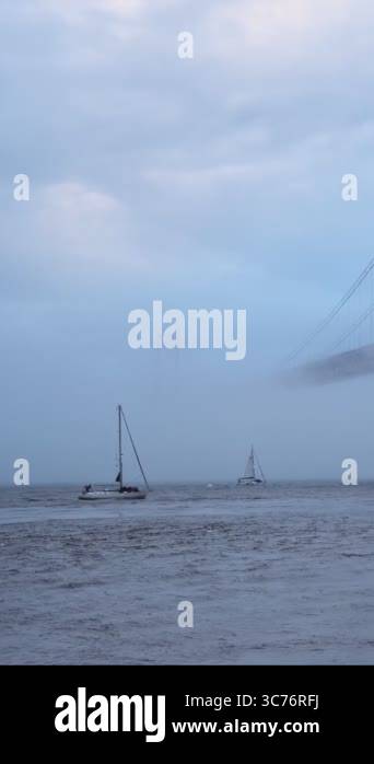 View of 25 de Abril Bridge famous tourist landmark of Lisbon connecting ...
