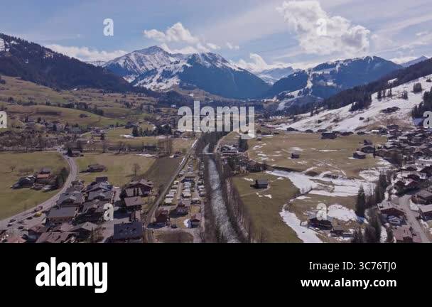 Aerial view of Gstaad valley, nestled amidst the majestic Swiss Alps ...