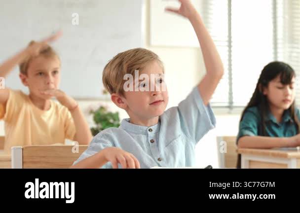 Caucasian boy raising hand for asking and answering teacher surrounded ...