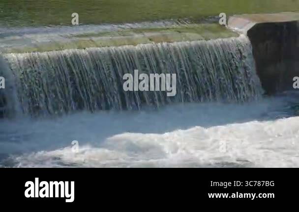 Dam on a small river, drop in water level Stock Video Footage - Alamy