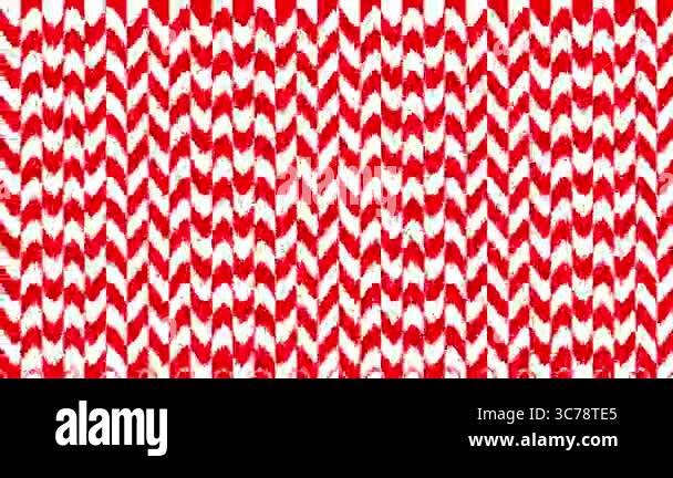 A seamless geometric pattern featuring a vibrant red and white chevron ...