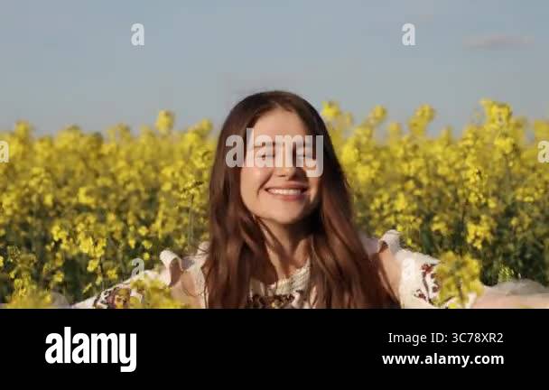 Artisanal stitched, Embroidered dress, Yellow horizon. Under clear blue ...