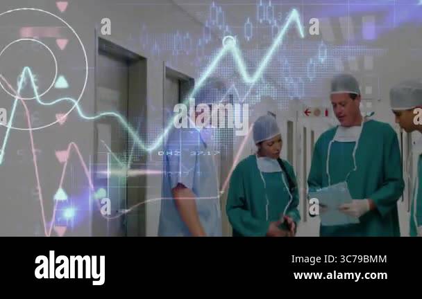 In hospital corridor, medical team discussing patient data with ...