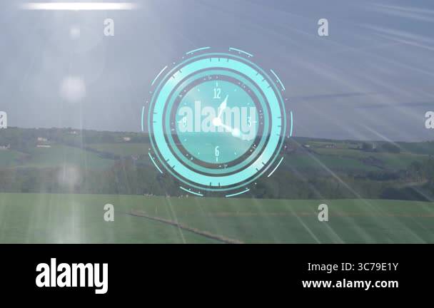 Sunlight streaming over countryside landscape with clock animation in ...