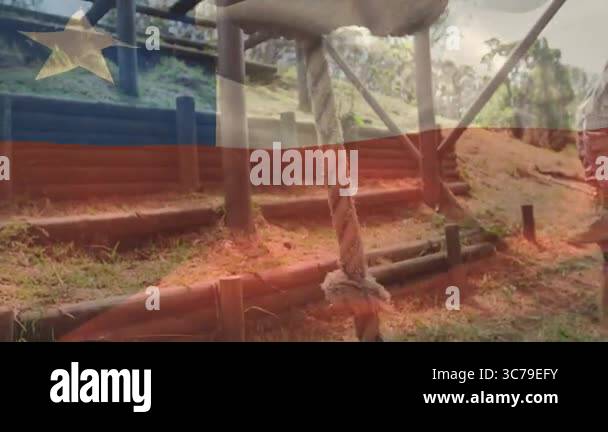 Climbing rope in outdoor training course, military boots near flag ...