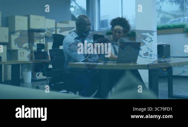 Collaborating at desk, business professionals using animation with ...