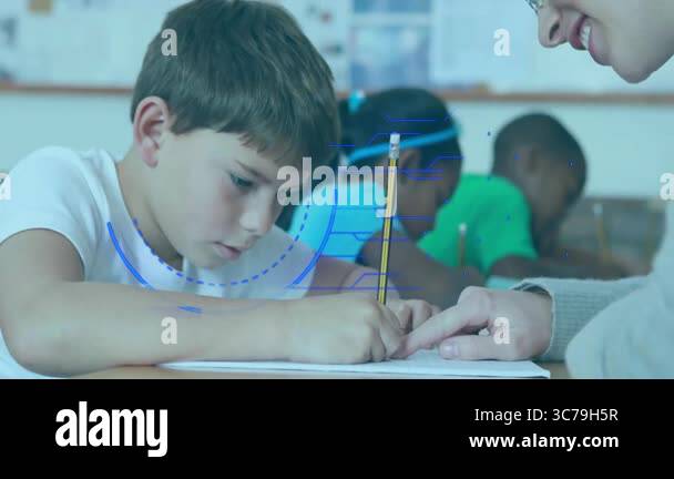 Teacher assisting focused student with digital brain interface ...