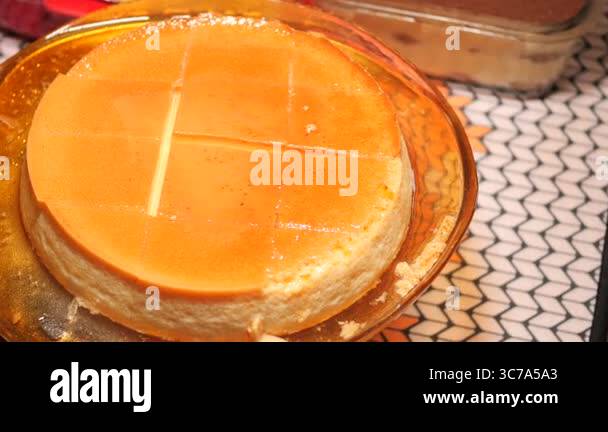 Enjoying homemade caramel pudding at a family gathering Stock Video ...