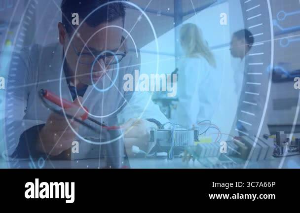 In laboratory, scientist working on electronics with digital animation ...