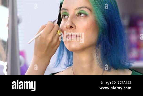 Process of making bright makeup. Make-up artist applying make-up on ...