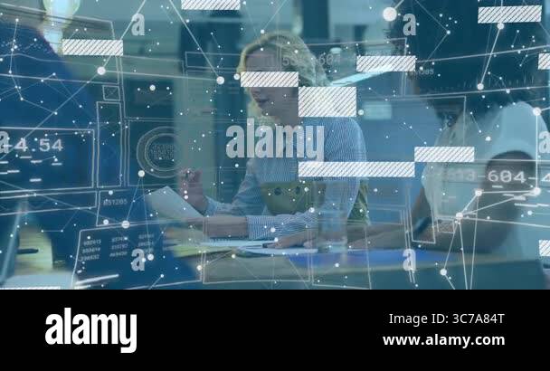 In office, businesswomen analyzing digital data with processing ...
