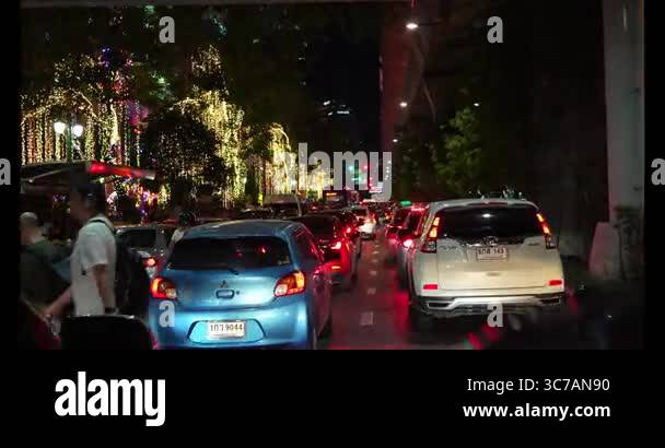 Footage of traffic jam at night, motorcycle POV crossing the traffic ...