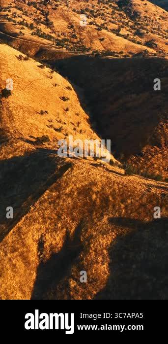 Brown rounded tops of California mountains with a lack of greenery ...