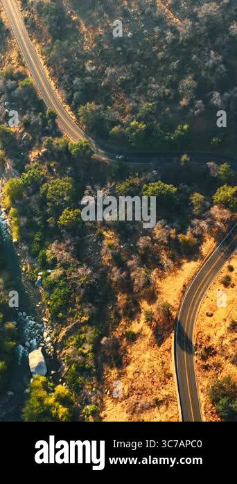 Dangerous highway in California mountains. Road over the river flowing ...