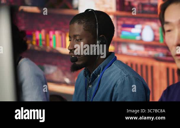 Team of multiethnic call center agents in workplace helping customers ...