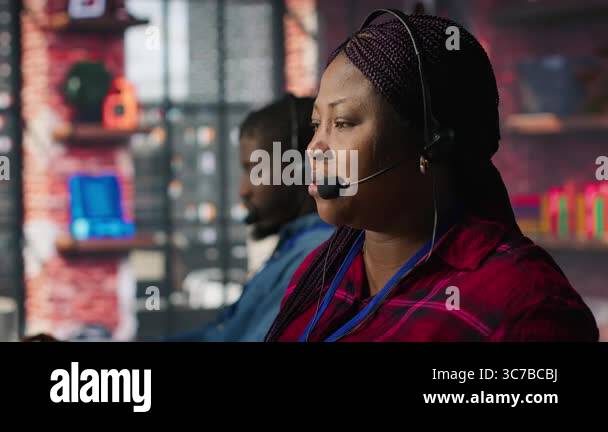 Call center agent listening to customer needs, providing step by step ...