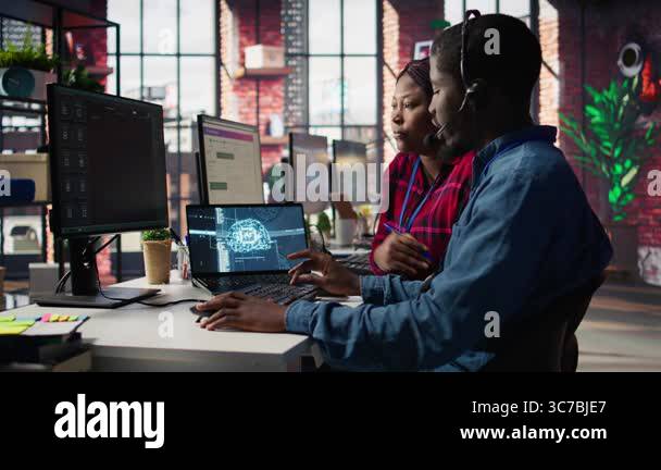 Call center manager teaching intern how to use AI to enhance customer interactions. Team leader ...