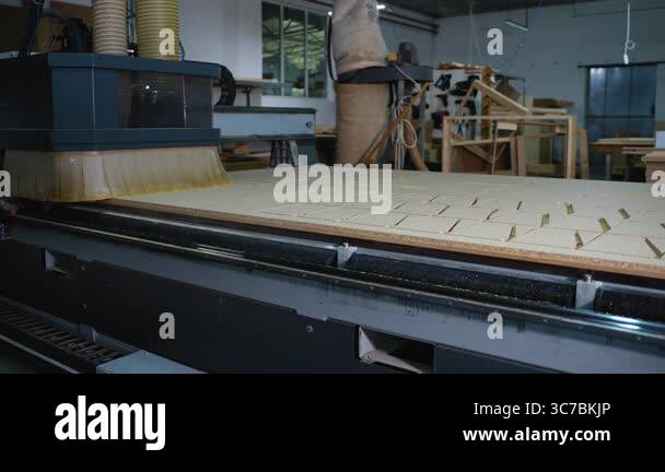 CNC machine router cuts MDF board into precise rectangular parts for ...