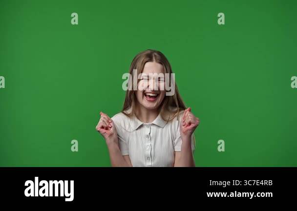 Teens emotions concept. Teenage girl posing at camera happy screaming ...