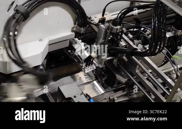 Industry. Production of auto wiring. Robots are automated. Wires and ...