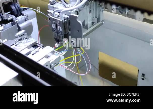 Industry. Production of auto wiring. Robots are automated. Wires and ...