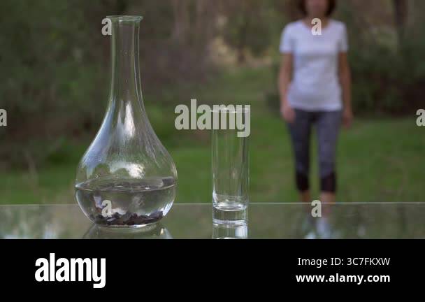 The girl is drinking water infused with shungite stones Stock Video ...