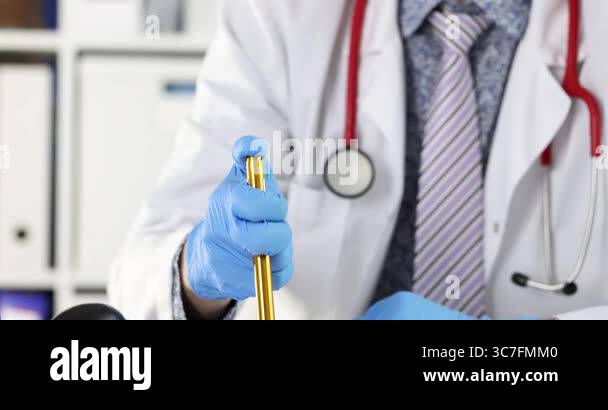 Doctor turns on flashlight to check patient irises in clinic. Bearded ...
