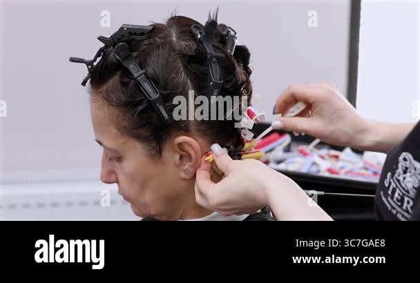 Professional hairdresser working with client, closeup. Hairdresser ...