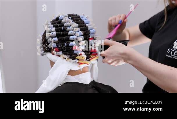 Professional hairdresser working with client, closeup. Hairdresser ...