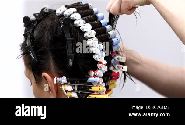 Professional hairdresser working with client, closeup. Hairdresser ...