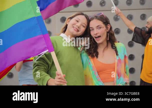 Excited participants enthusiastically waving cheerful flags at a ...